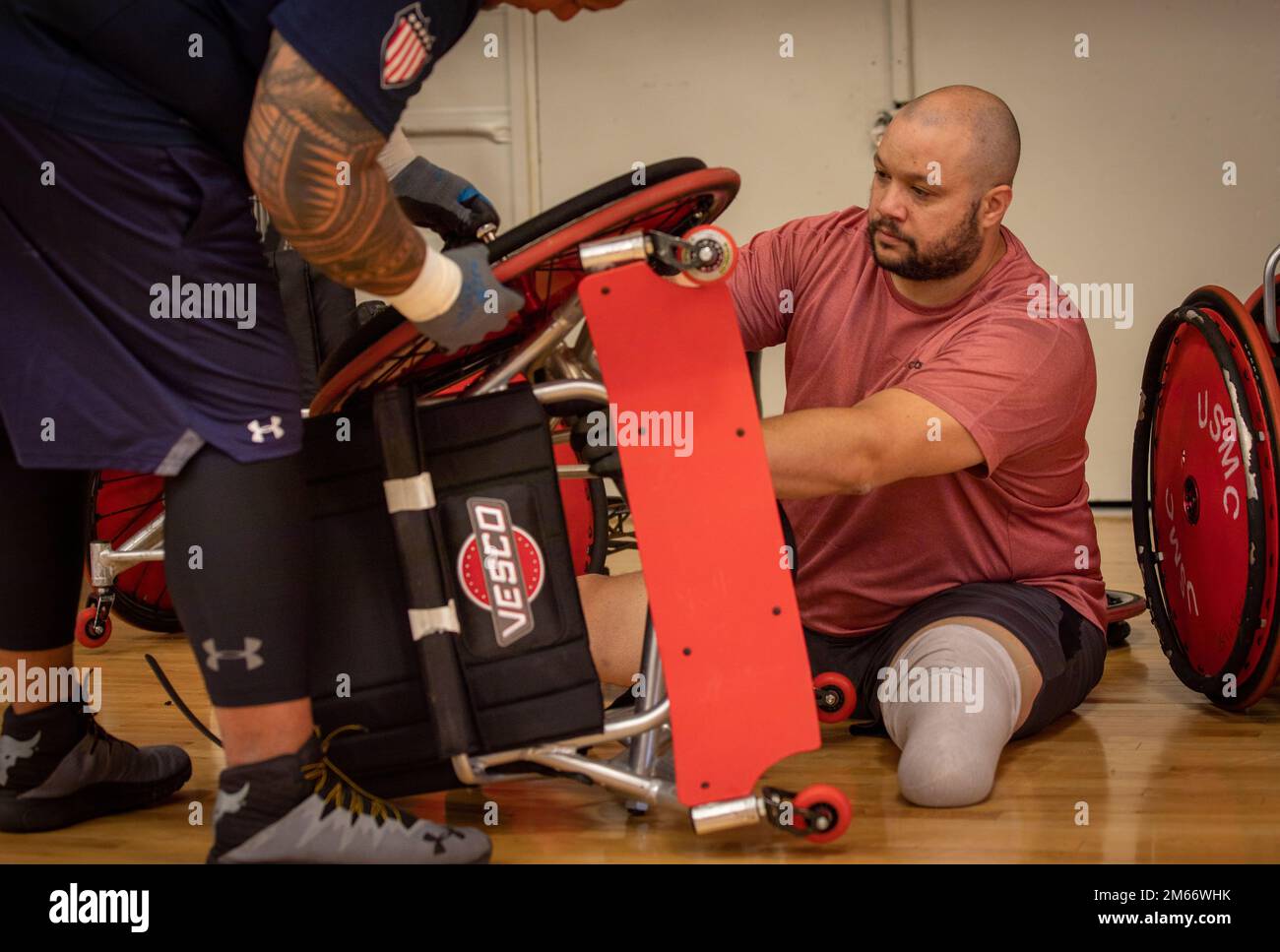 Retired U.S. Army Capt. Dandy Wilson, Team U.S., assembles a wheel at ...