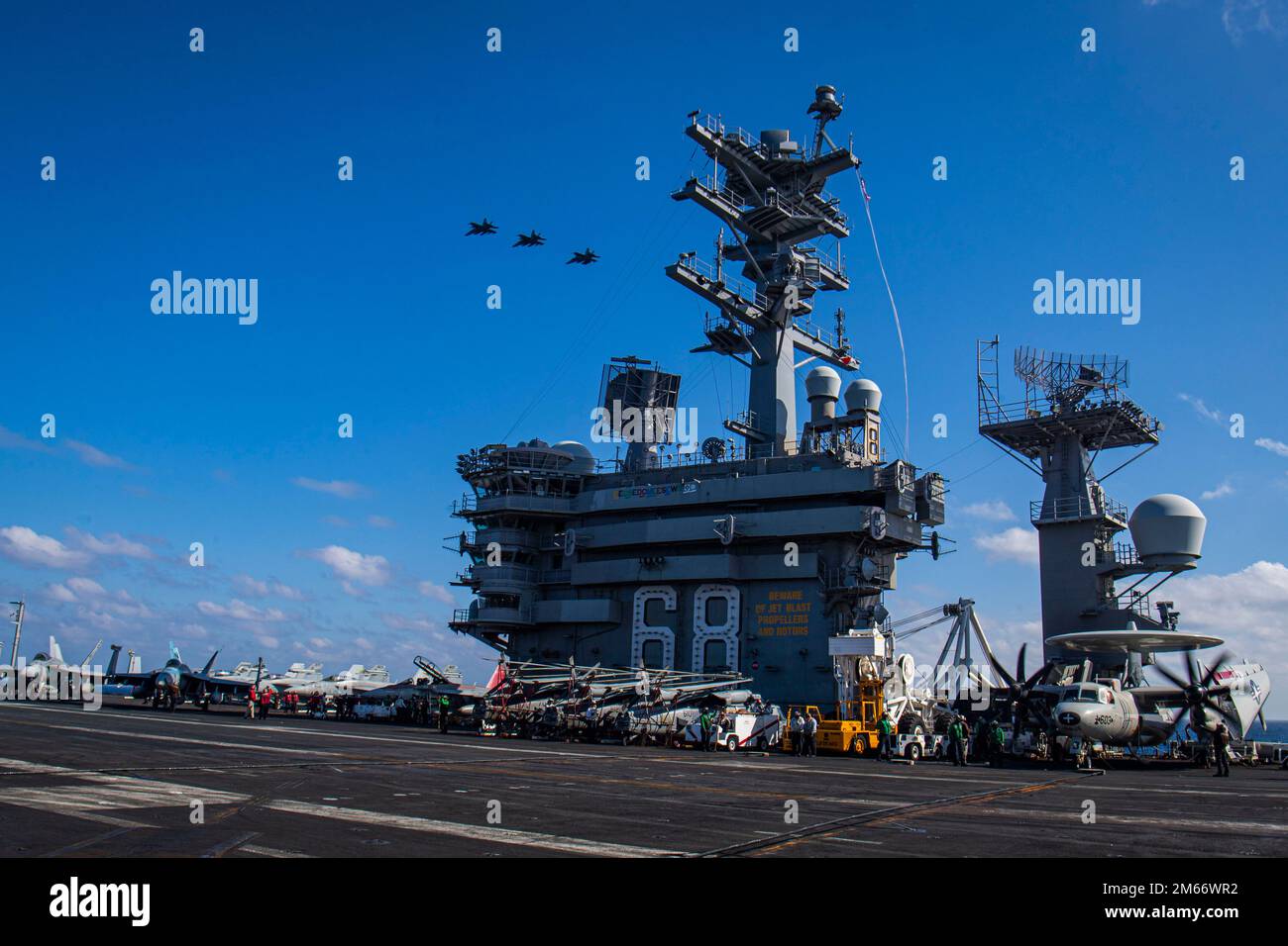 230102-N-MH015-1257 PHILIPPINE SEA (Jan. 2, 2023) U.S. Navy aircraft fly in formation above the ...