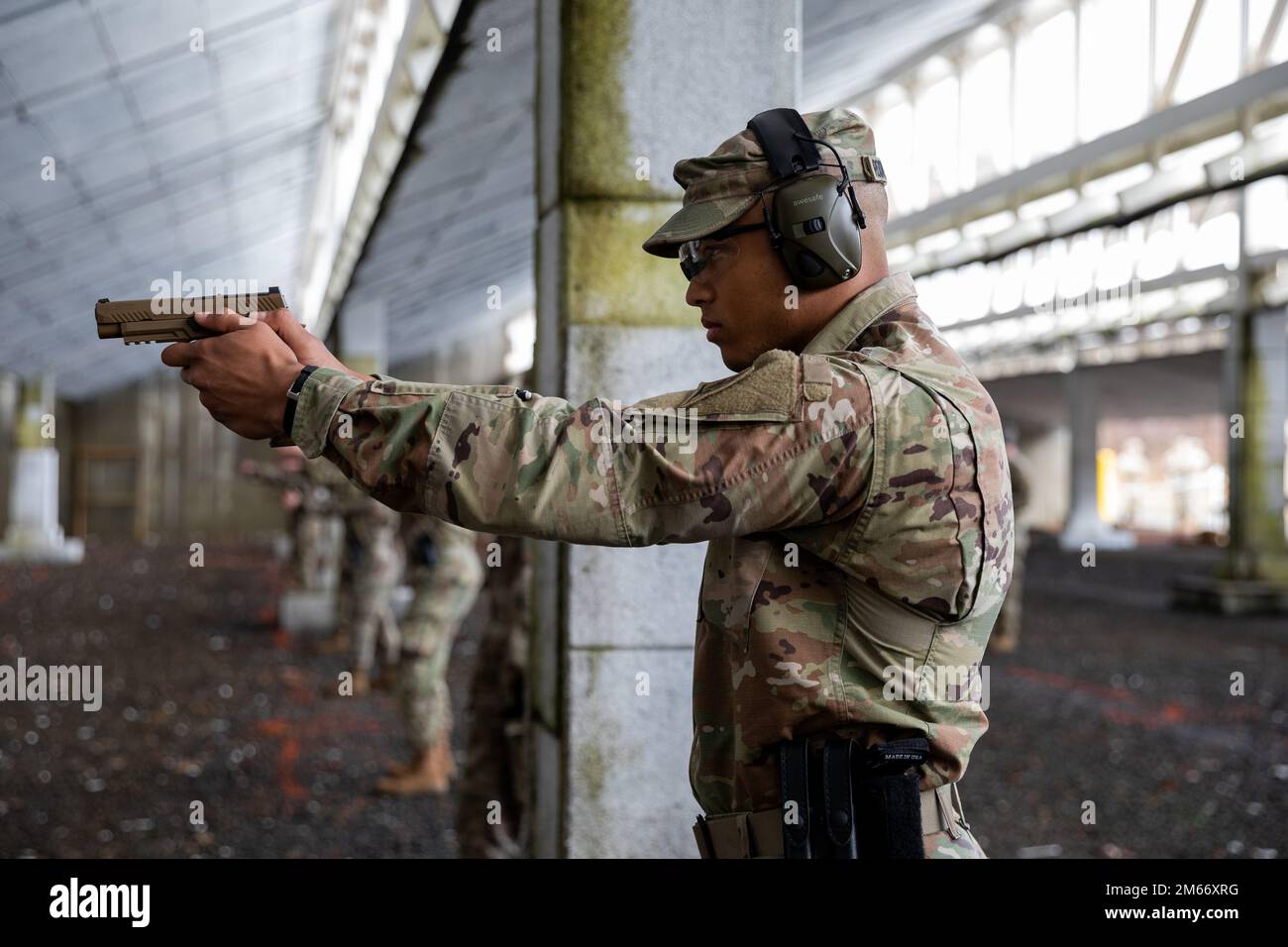 U.S. Army Sgt. Luis Rodriguez, a veterinary food inspection specialist ...
