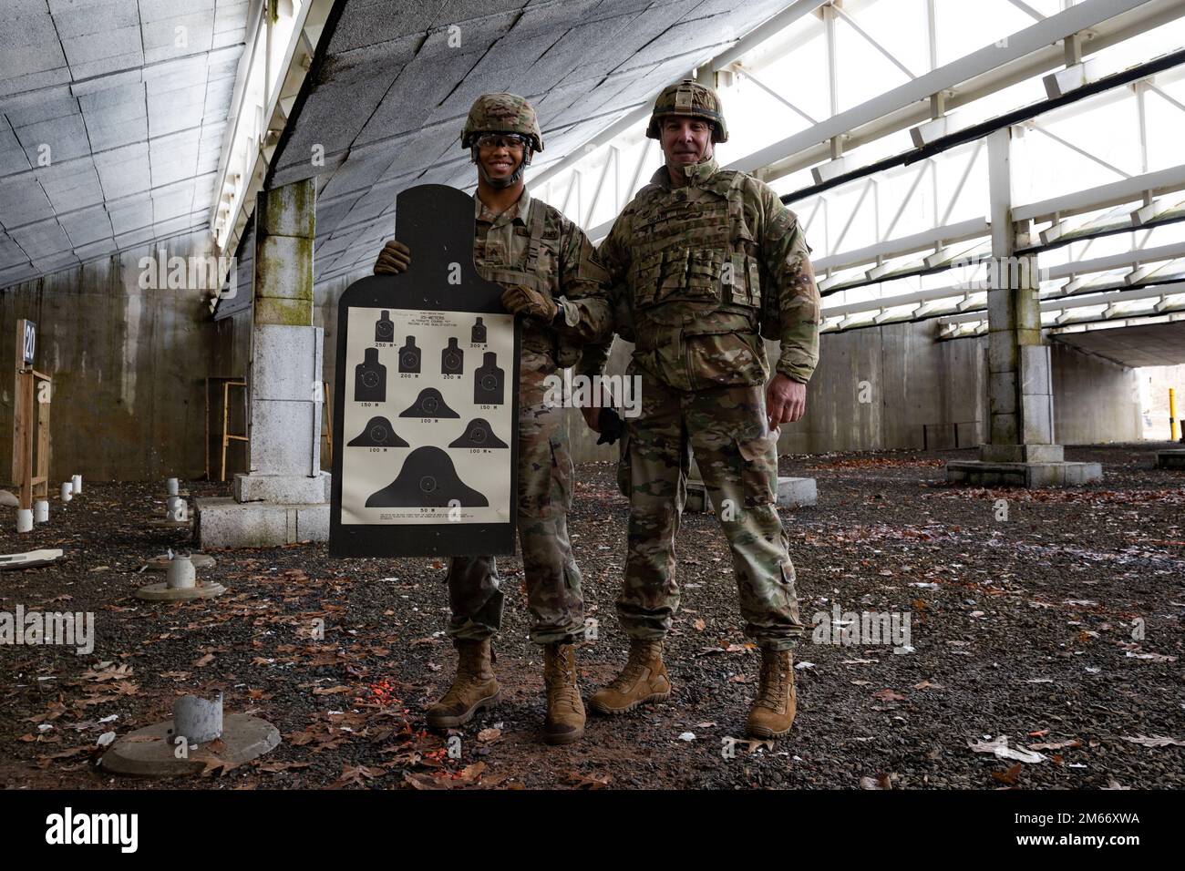 U.S. Army Sgt. Luis Rodriguez, left, a veterinary food inspection ...