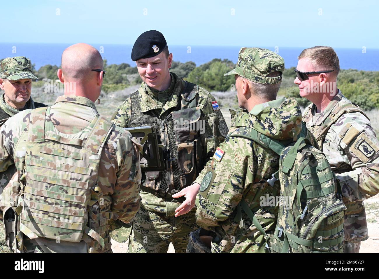 (From left to right) U.S. Army Capt. Mitchel Hess, 173rd Airborne ...
