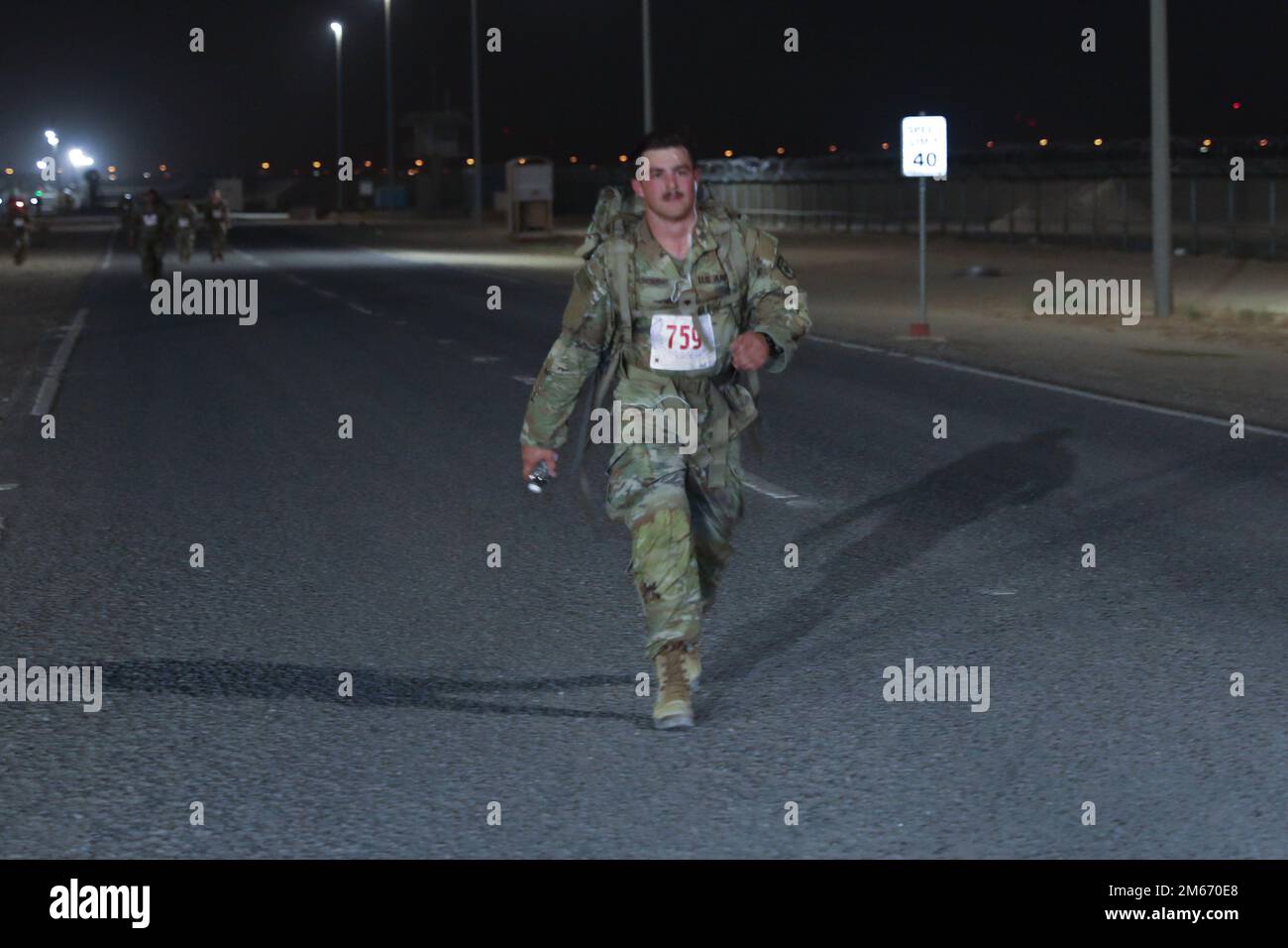 CAMP ARIFJAN, Kuwait- U.S. Soldiers compete in a Norwegian Ruck March ...