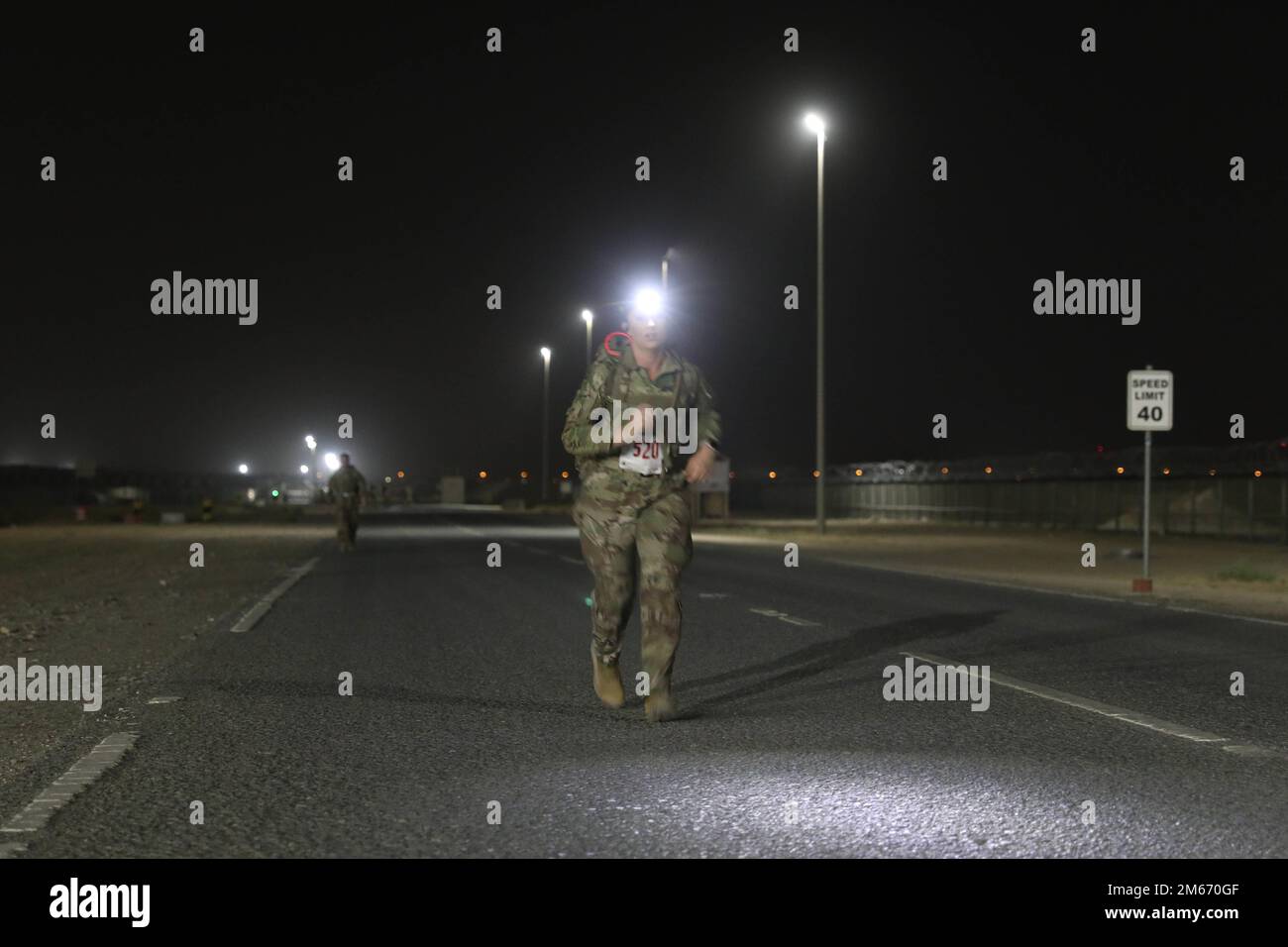 CAMP ARIFJAN, Kuwait- U.S. Soldiers compete in a Norwegian Ruck March ...