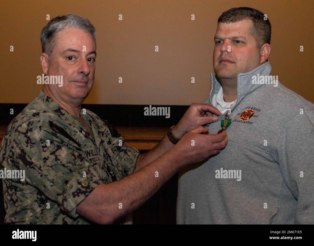 GREAT LAKES, Il. (Apr. 8, 2022) Samuel Johnston receives an award from ...