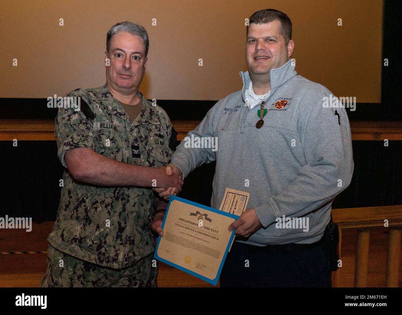 GREAT LAKES, Il. (Apr. 8, 2022) Samuel Johnston receives an award from ...