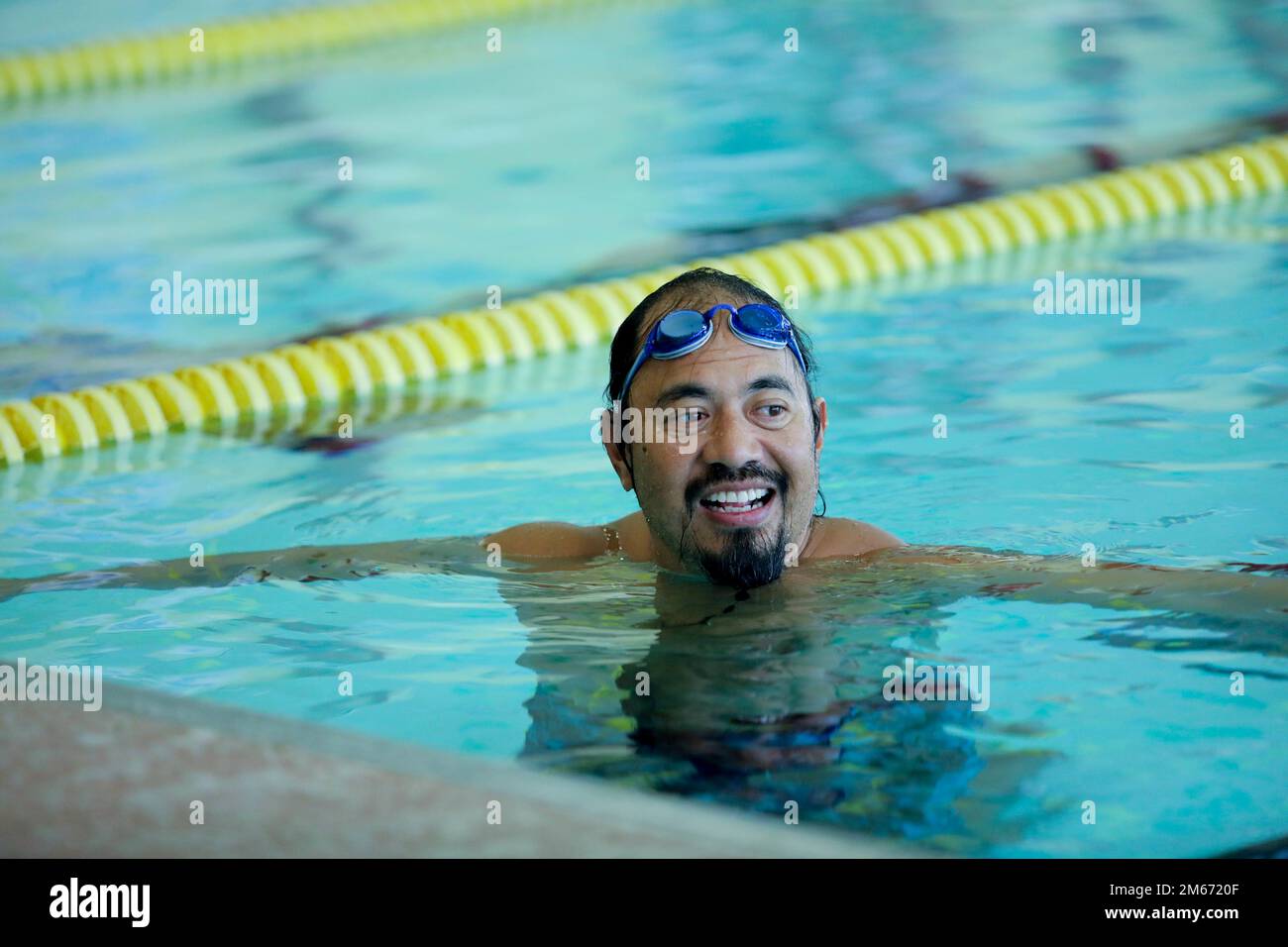 Retired U.S. Air Force Chief Master Sgt. Garrett Kuwada catches his ...