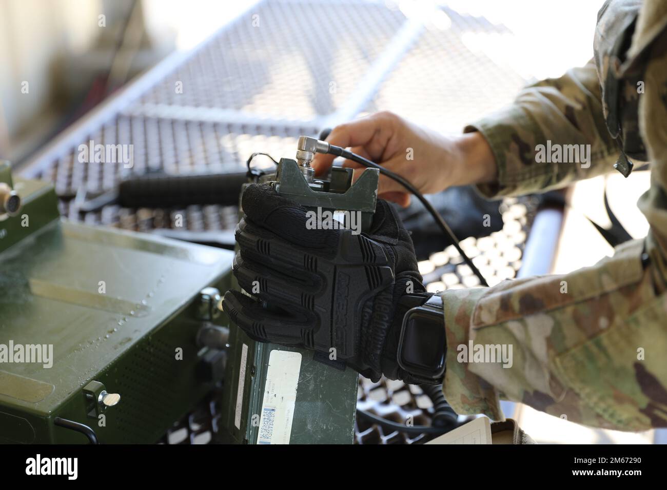 A Soldier programs a radio during the Best Warrior Competition at Fort ...