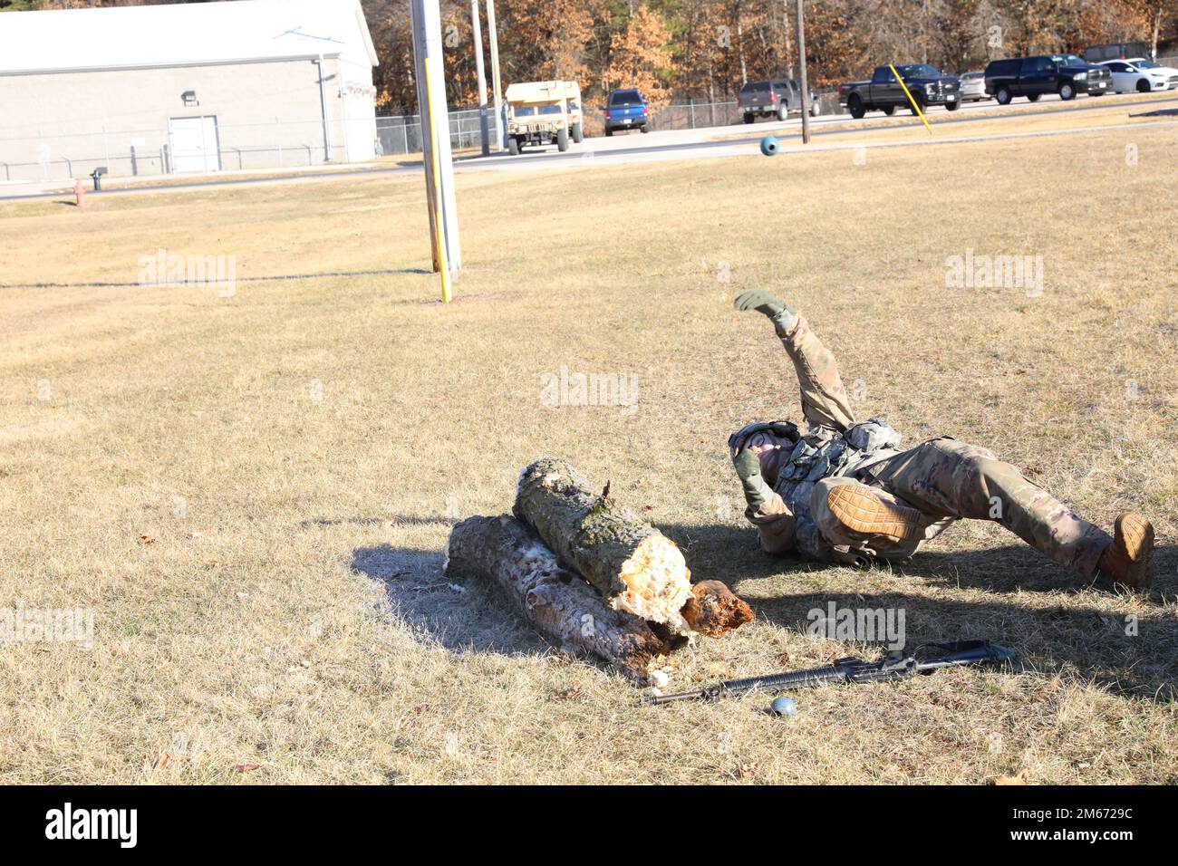 A Soldier throws a practice grenade during the Best Warrior Competition ...
