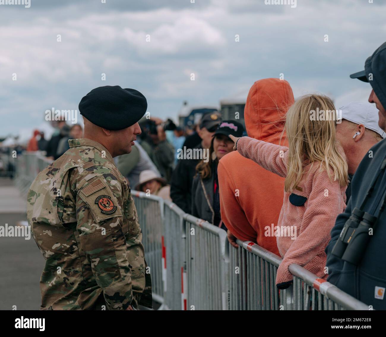 A young spectator interacts with a member of the 628 Security Forces ...