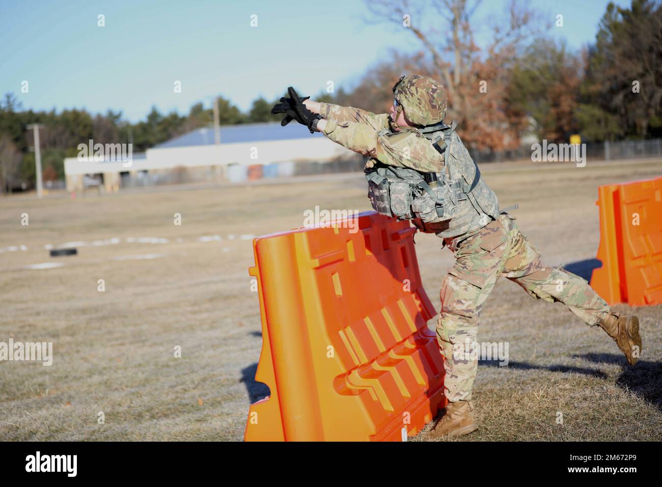 A Soldier throws a practice grenade during the Best Warrior Competition ...