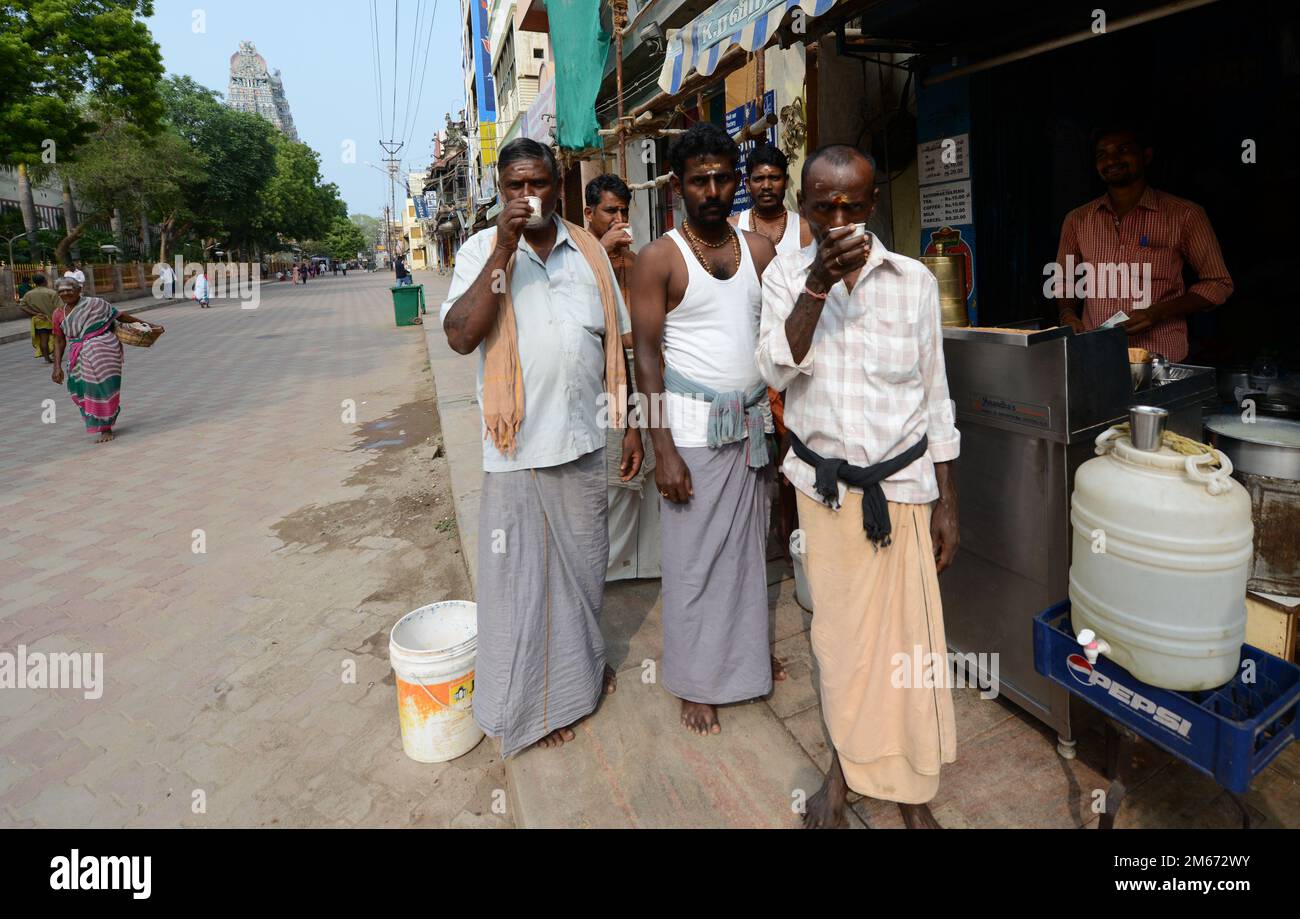 Tamil men drinking traditional milk tea at a Chai shop near the ...