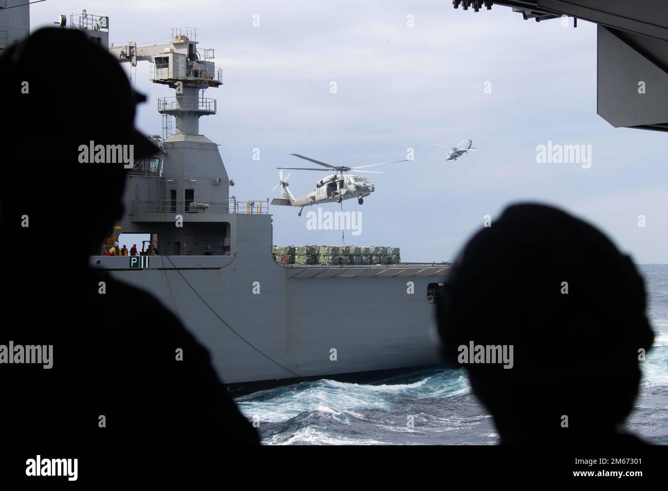 Lt. Cmdr Deena Abt and CWO3 Dallas Rodriguez watch from the USS Gerald ...