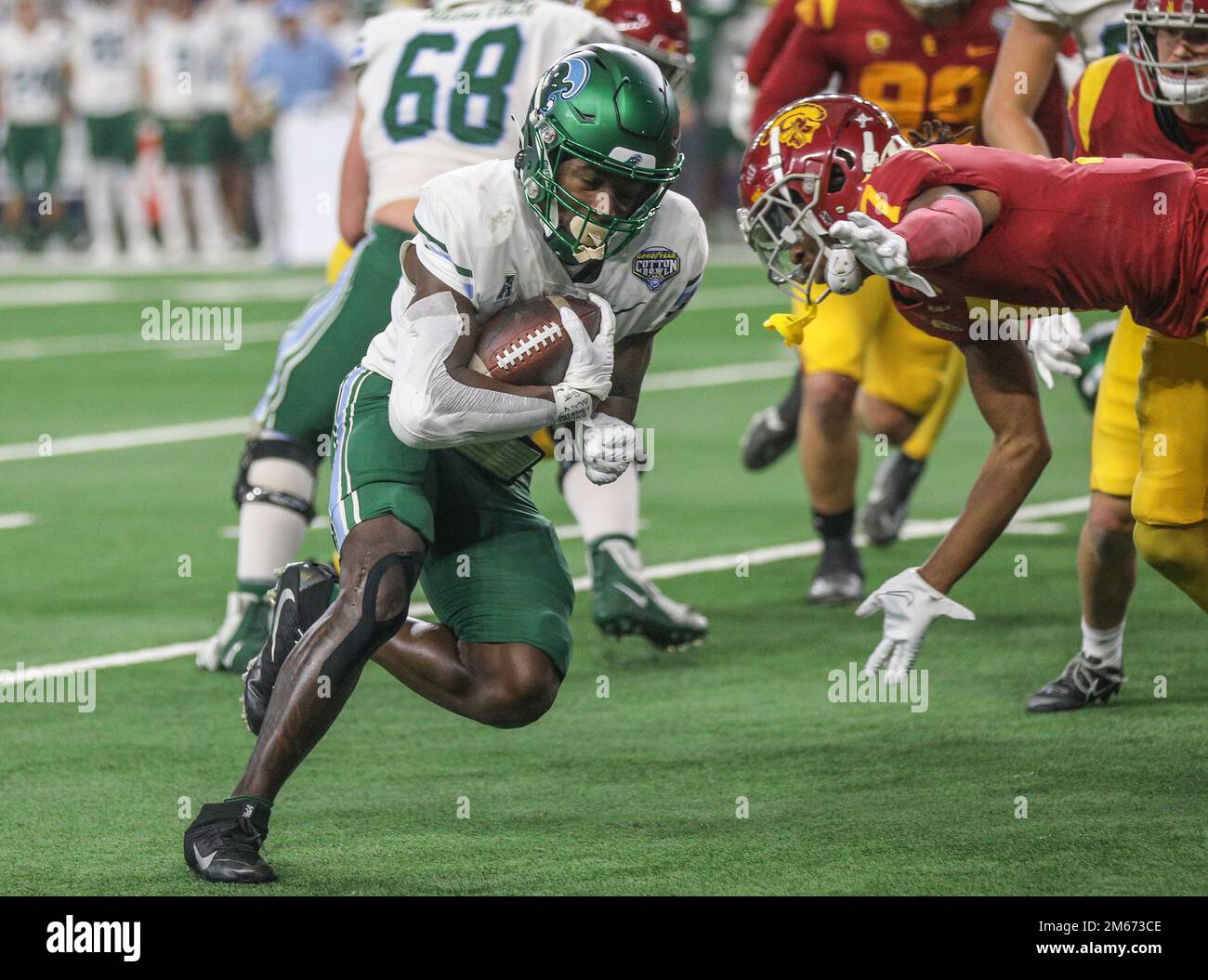 January 2, 2023: Tulane's Tyjae Spears (22) lowers his shoulder during ...