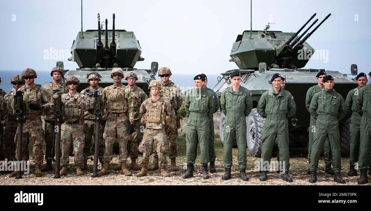 U.S. Army paratroopers assigned to the 173rd Airborne Brigade stand ...