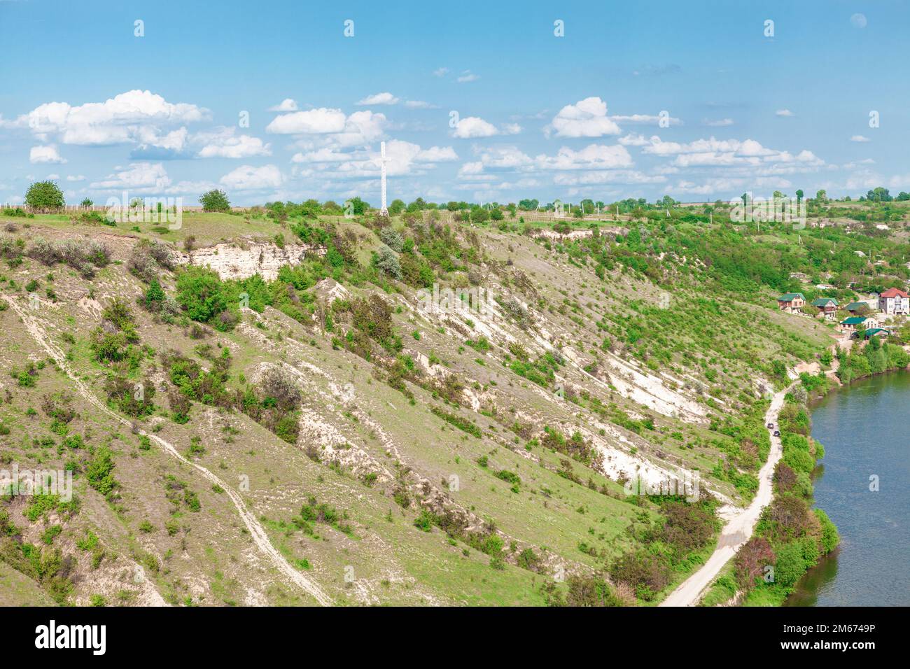 Coastal green hill . Riverside village scenery Stock Photo - Alamy