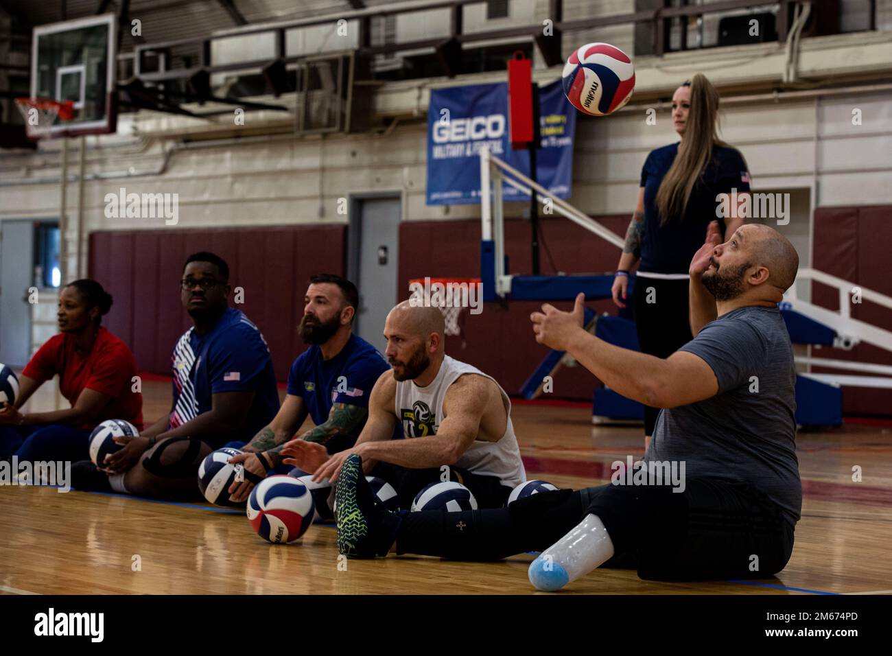 Retired U.S. Army Capt. Dandy Wilson, Team U.S., serves a volleyball ...