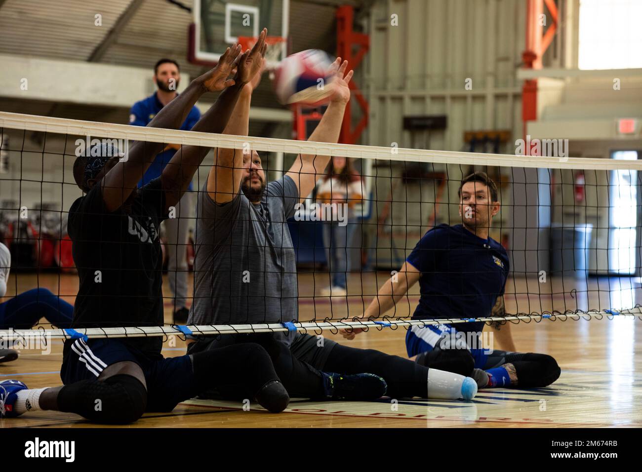 Retired U.S. Army Capt. Dandy Wilson, Team U.S., blocks a volleyball ...