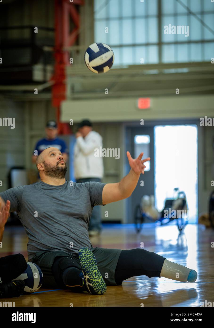 Retired U.S. Army Cpt. Dandy Wilson, Team U.S., serves a volleyball at ...