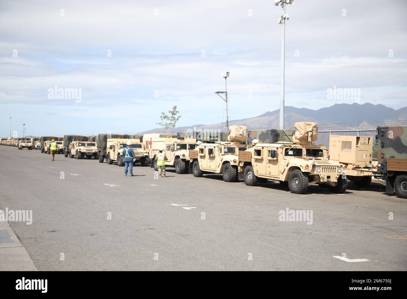 As part of the Army Prepositioned Stock 3, military vehicles are staged ...