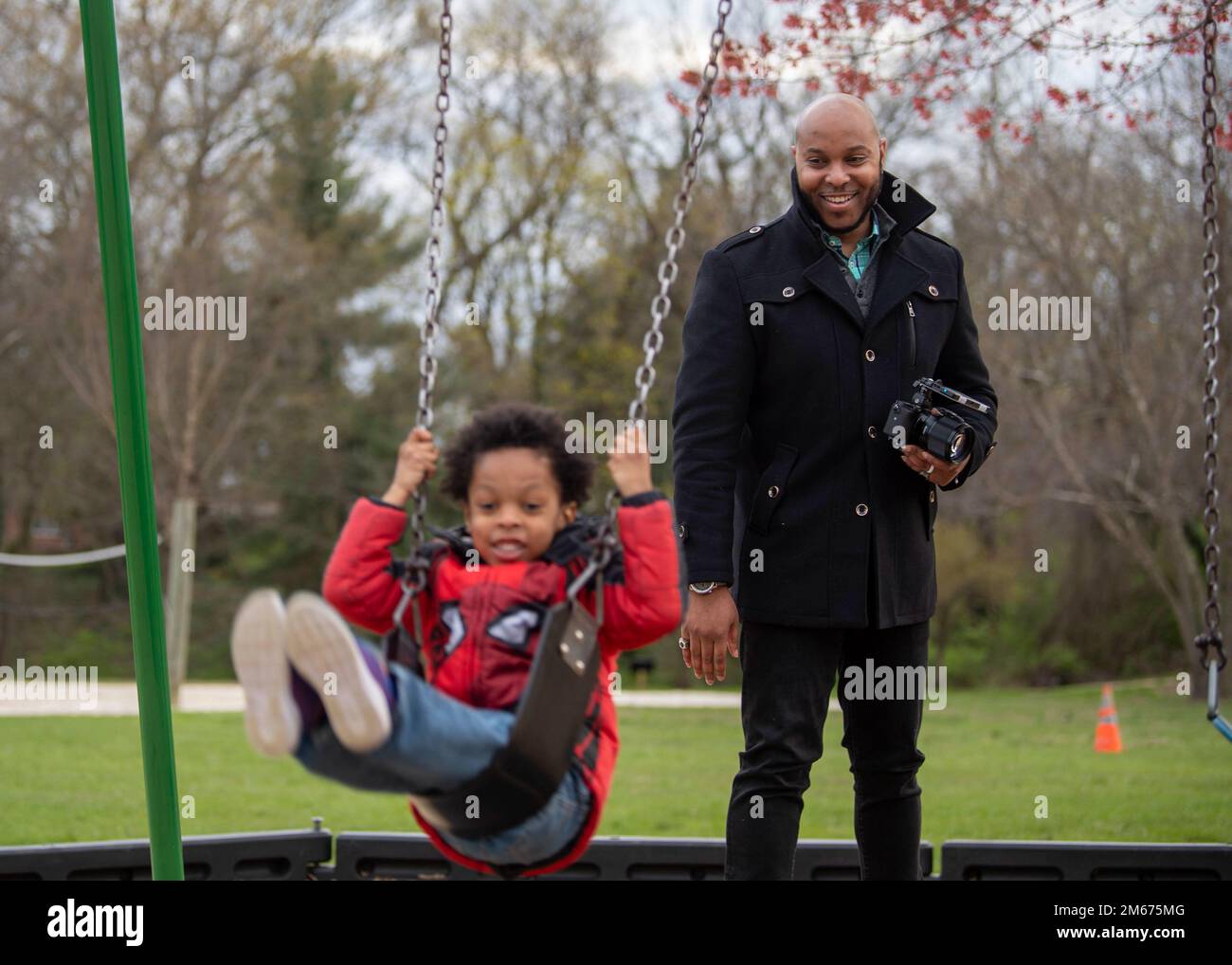 Cleveland Brown V watches his son, Cleveland Brown VI, 4, swing at ...