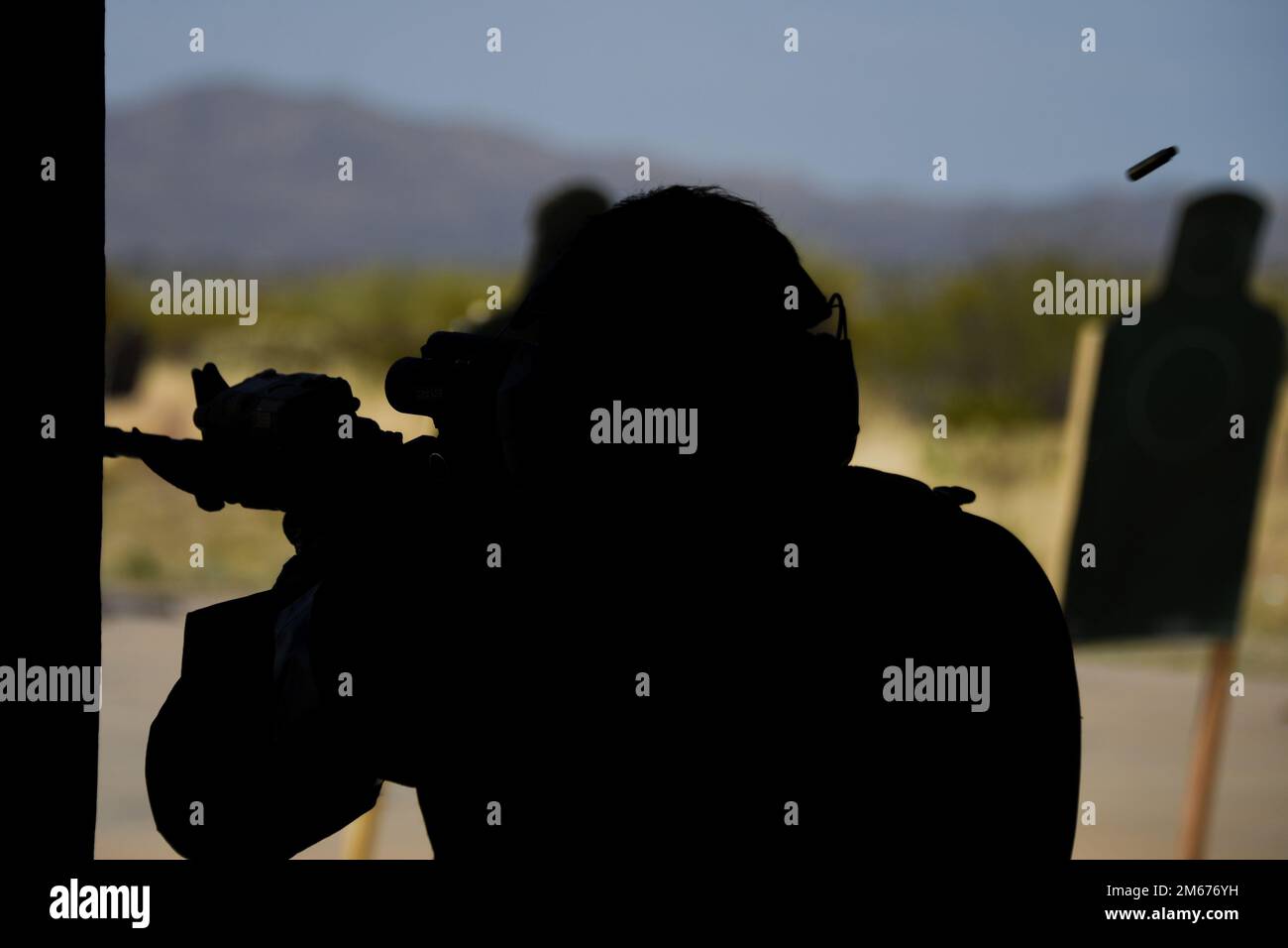 A member of the 355th Security Forces Squadron fires down range while ...