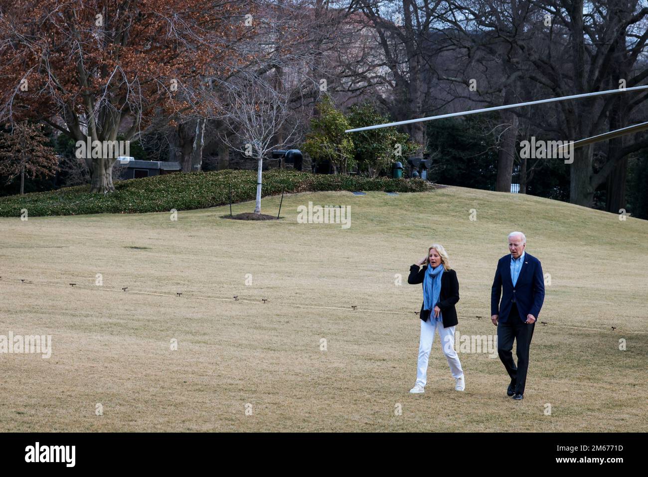 President Joe Biden and first lady Jill Biden walk on the South Lawn as ...