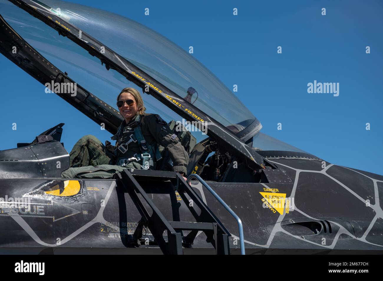 U.S. Air Force Capt. Aimee Fiedler disembarks from her jet after an ...