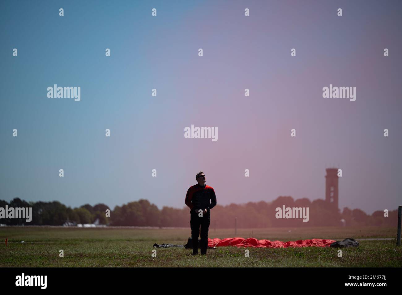A U.S. Army Black Dagger member looks up during an aerial performance ...
