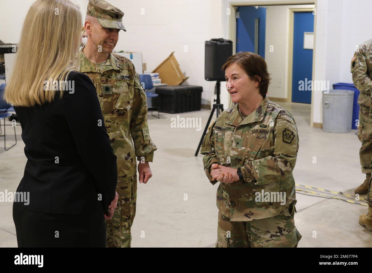 U.S. Army Brig. Gen. Laura McHugh, right, Deputy Adjutant General-Army ...
