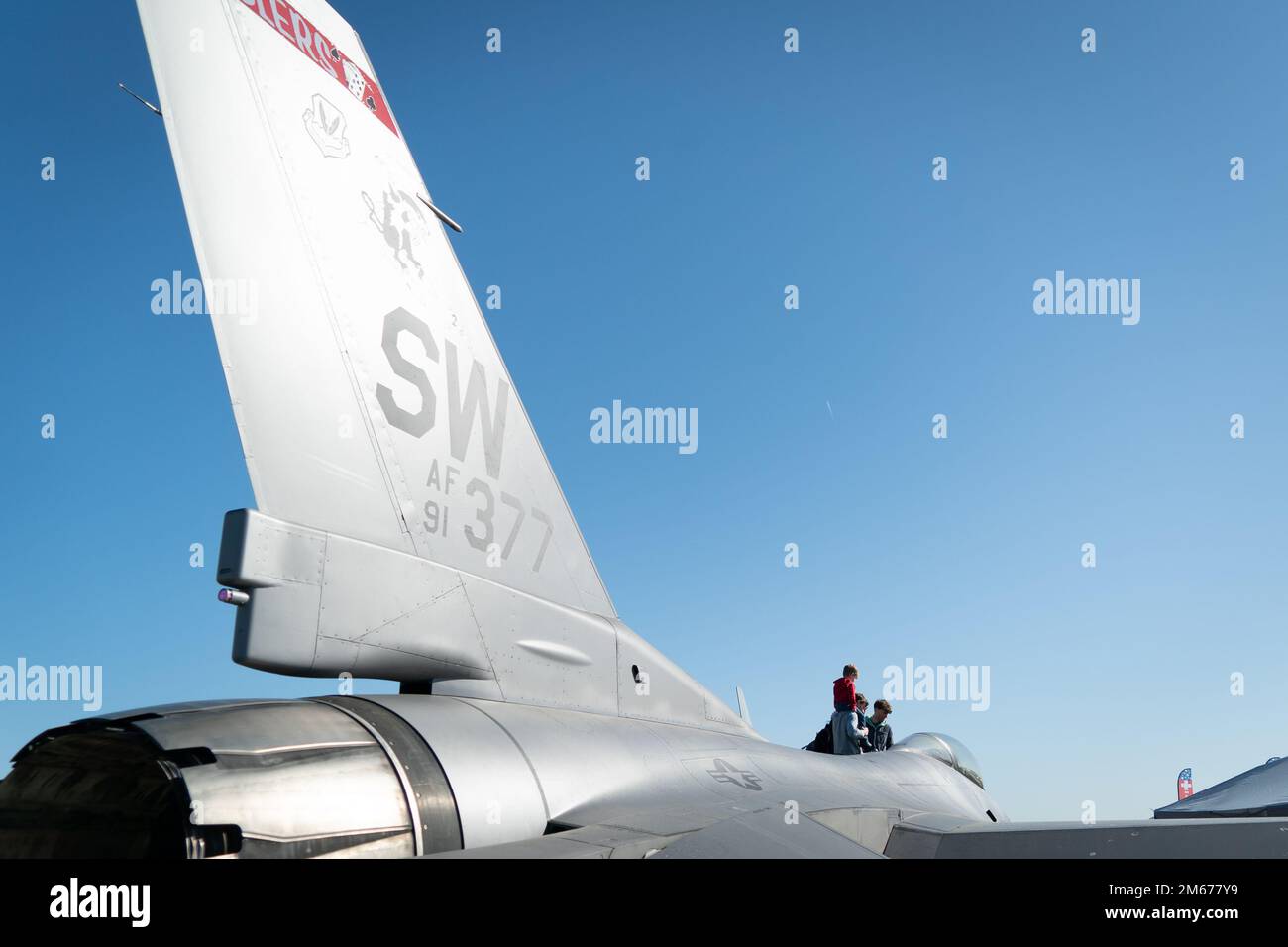 Families view a static F-16 Fighting Falcon at the Titans of Flight Air ...