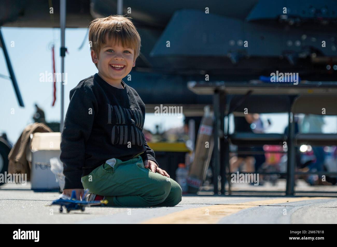 Child plays with a Blue Angels fighter jet toy at the Titans of Flight ...