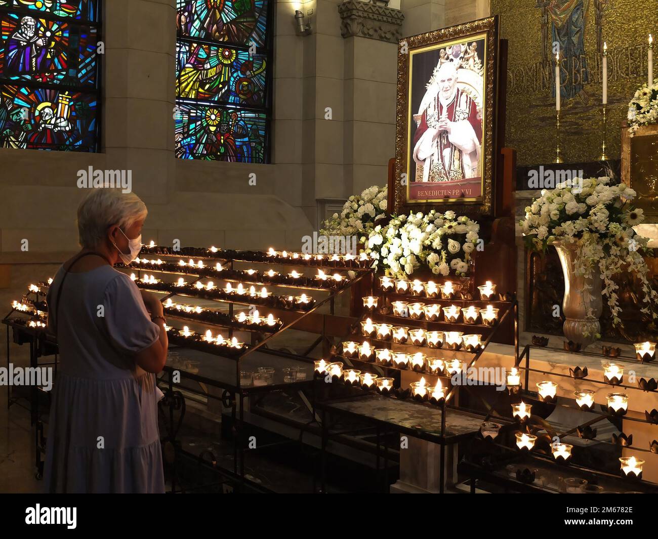 An old woman seen praying for the repose of the soul of the late Pope ...