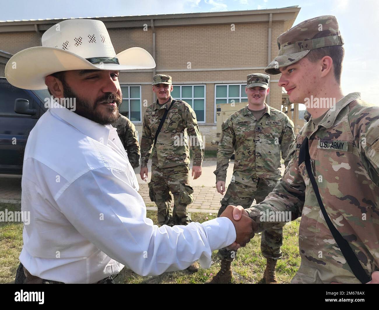 Country musician Isaac Jacob from Falfurrias, Texas (left), shakes ...