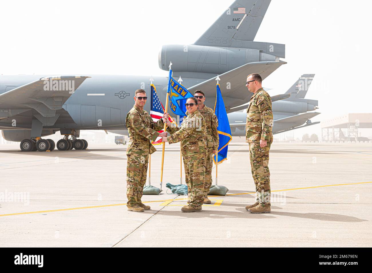 U.S. Air Force Lt. Col. Lindsey Bauer, center, relinquishes command of ...