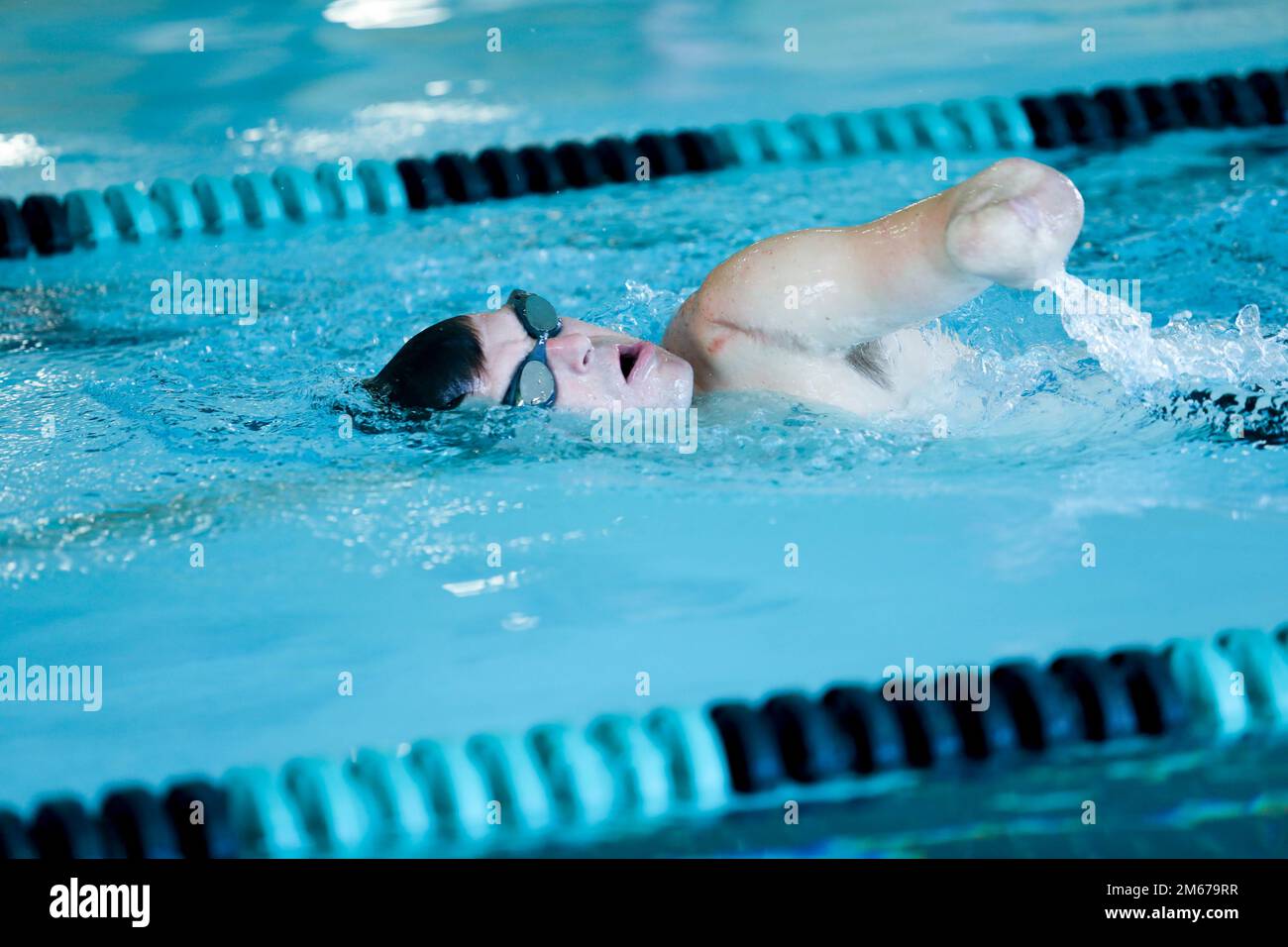 Retired U.S. Marine Corps Sgt. Michael Nicholson does some laps in the ...
