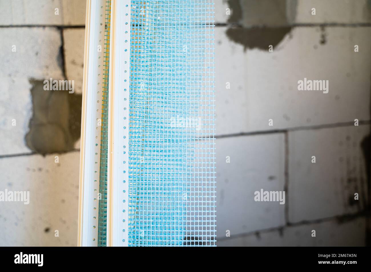 PVC window profile with cuff and mesh close-up at a construction site ...