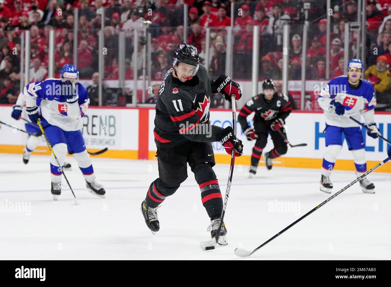 Canada's Dylan Guenther takes a shot on net during second period IIHF ...