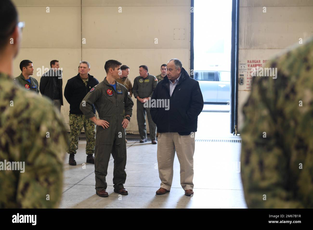 Secretary of the Navy Carlos Del Toro, right, speaks with Cmdr. Warren ...