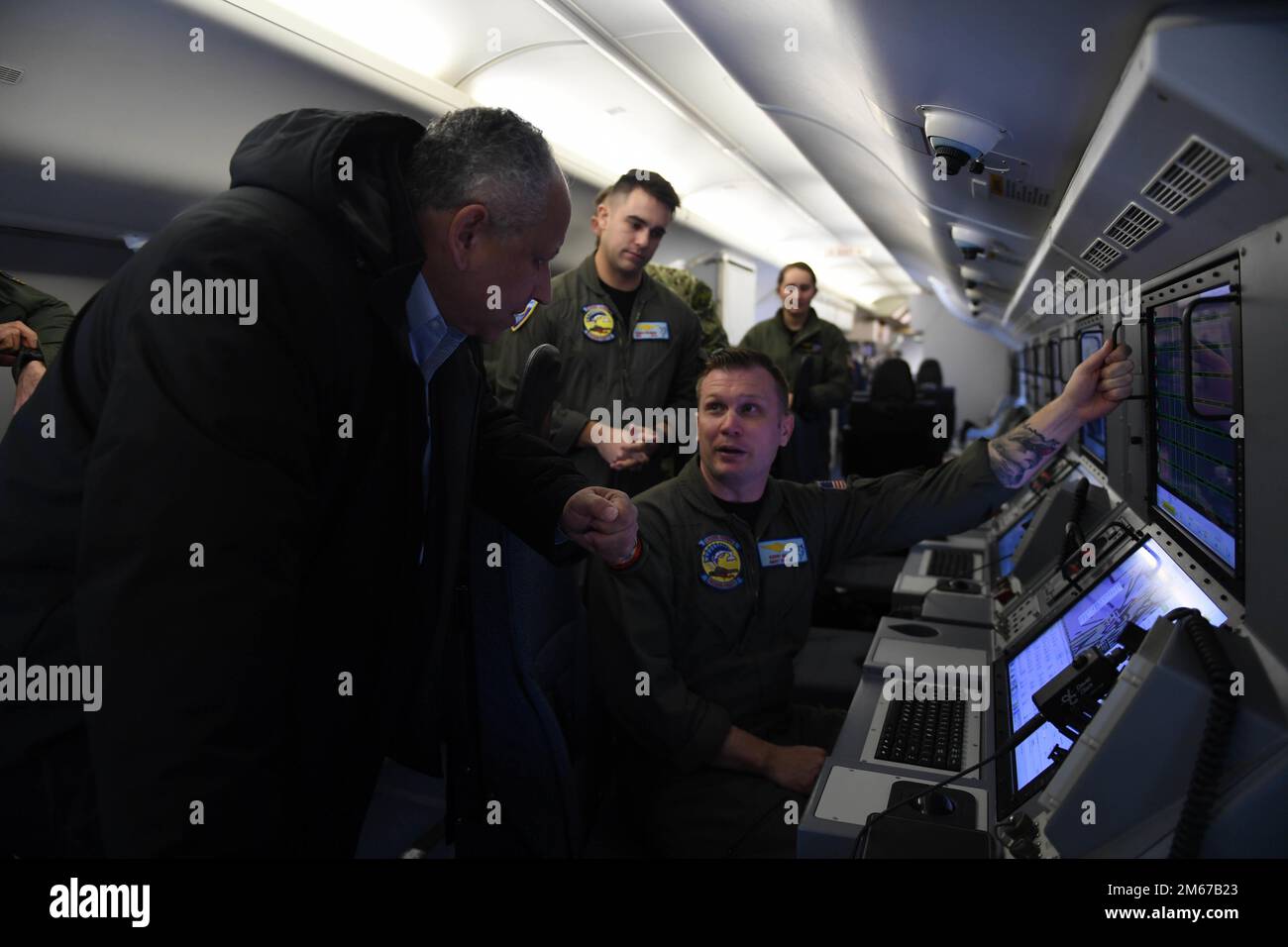 Secretary of the Navy Carlos Del Toro, left, speaks with Naval Air ...
