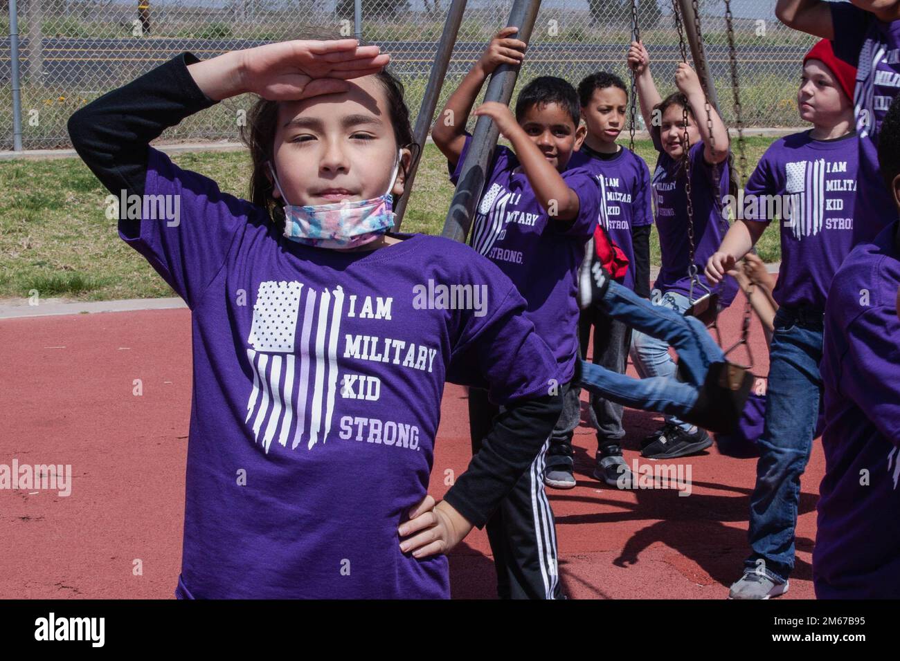 A student with Stuart Mesa Elementary School poses with a salute on ...