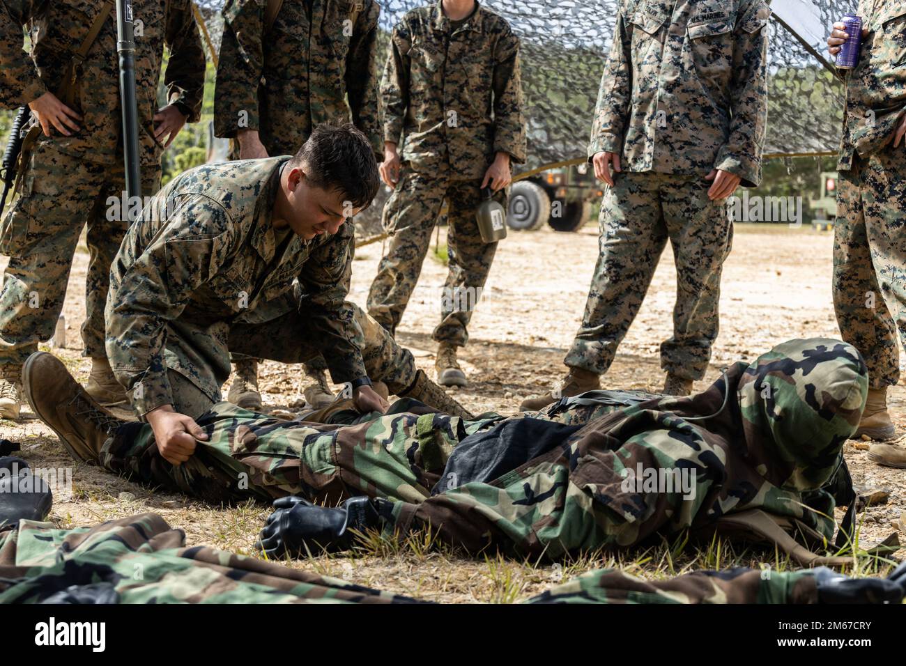U.S. Marine Corps Cpl. Brandon Simmons, left, an ammunition technician ...