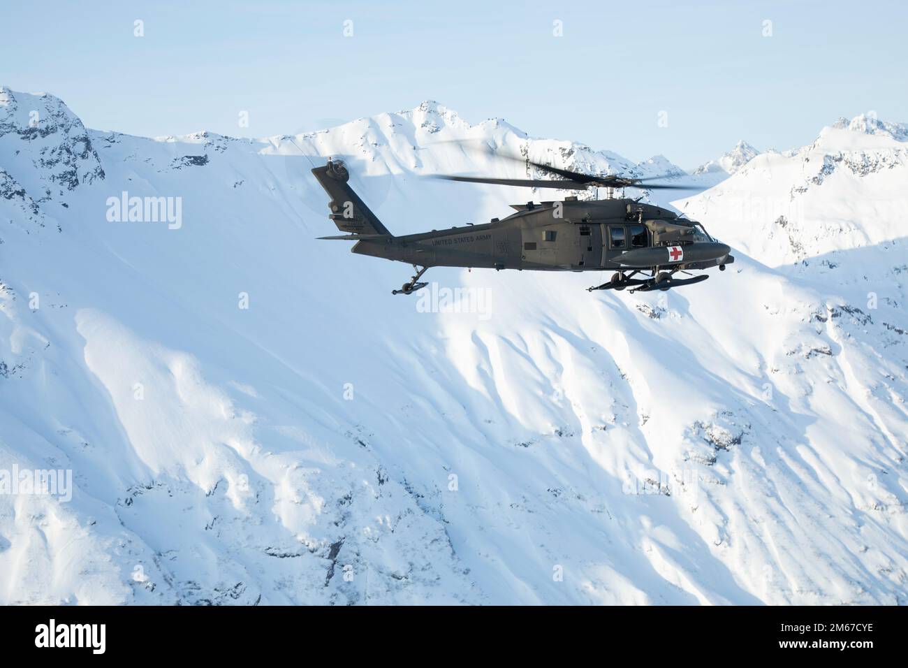 Members of the 2-211th General Support Aviation Battalion transport an ...
