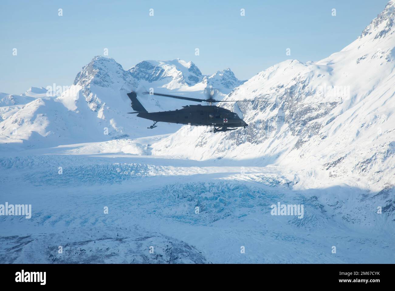 Members of the 2-211th General Support Aviation Battalion transport an ...