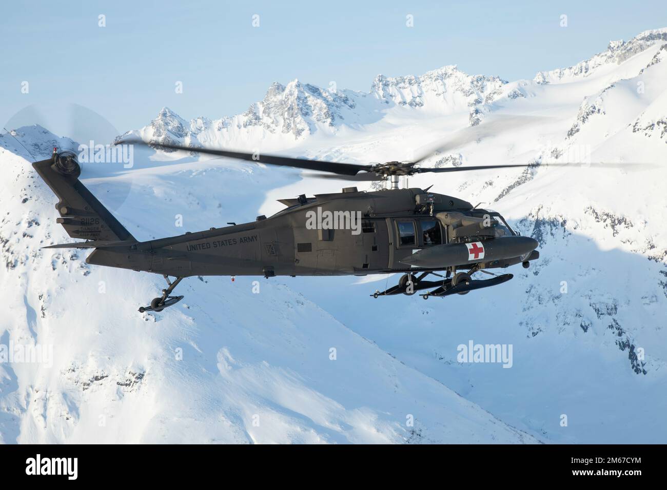 Members of the 2-211th General Support Aviation Battalion transport an ...