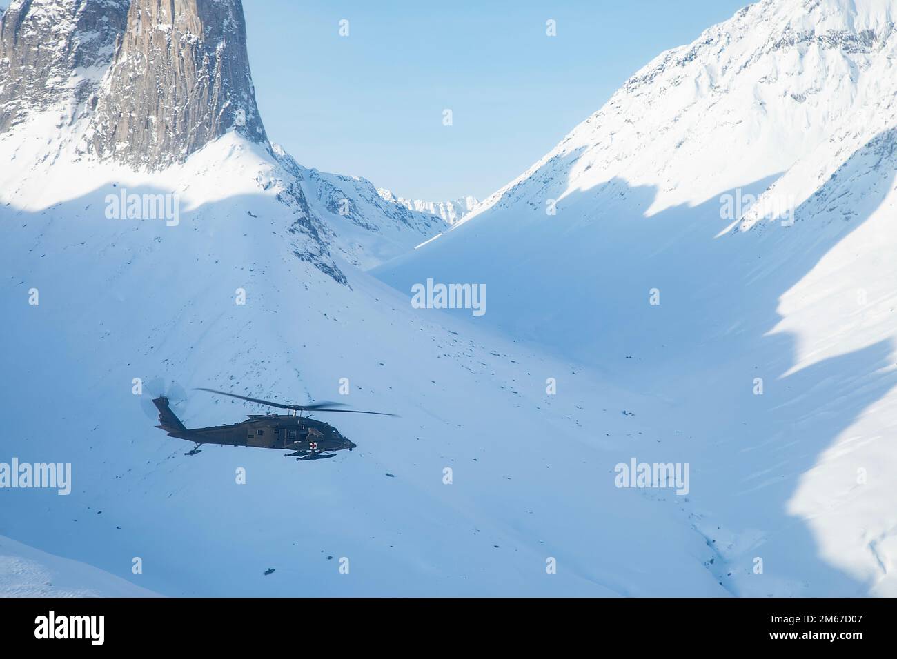 Members of the 2-211th General Support Aviation Battalion transport an ...