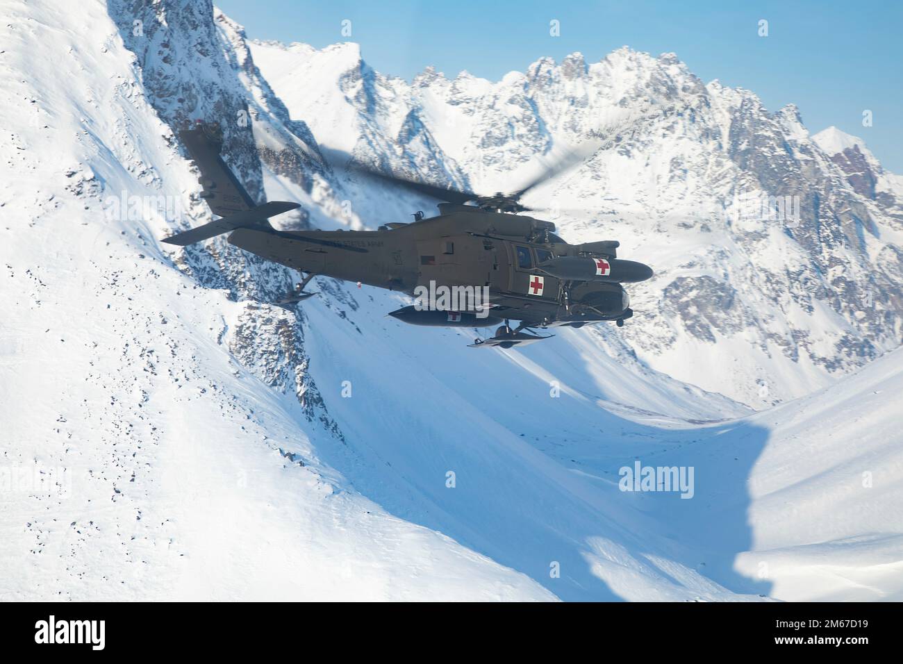 Members of the 2-211th General Support Aviation Battalion transport an ...