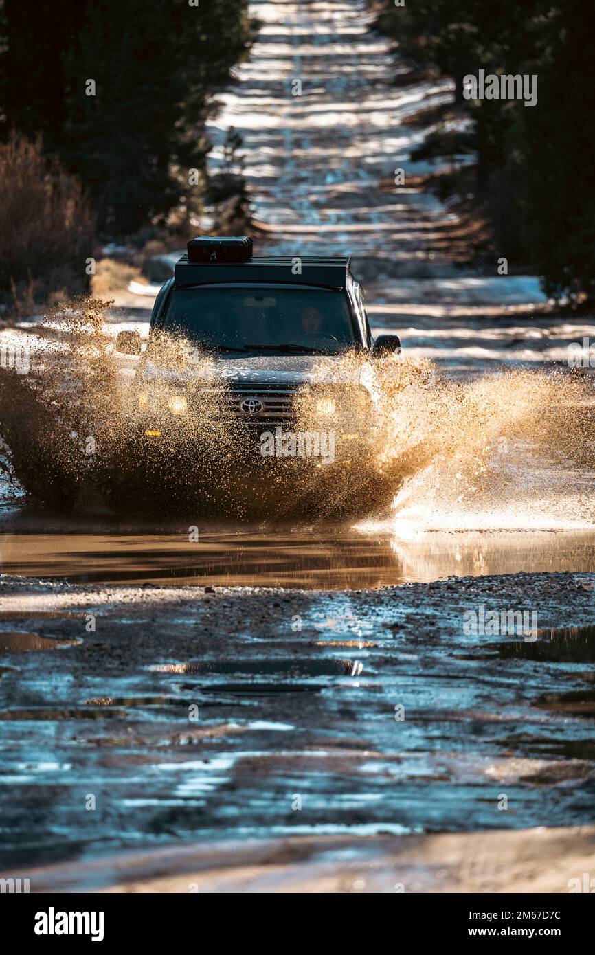 Front Angle view of Off Road Overland Land Cruiser SUV crossing water ...