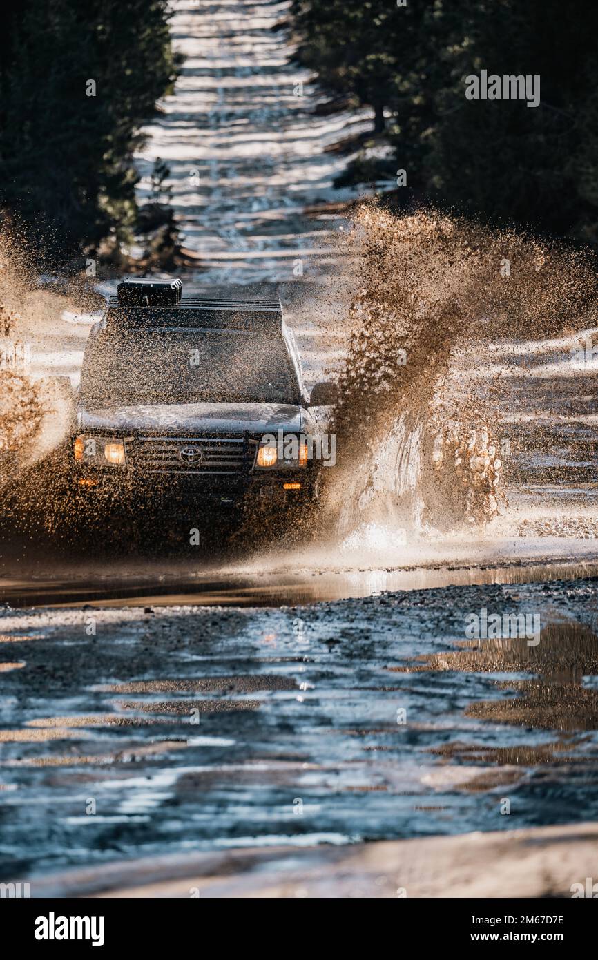 Front Angle view of Off Road Overland Land Cruiser SUV crossing water ...