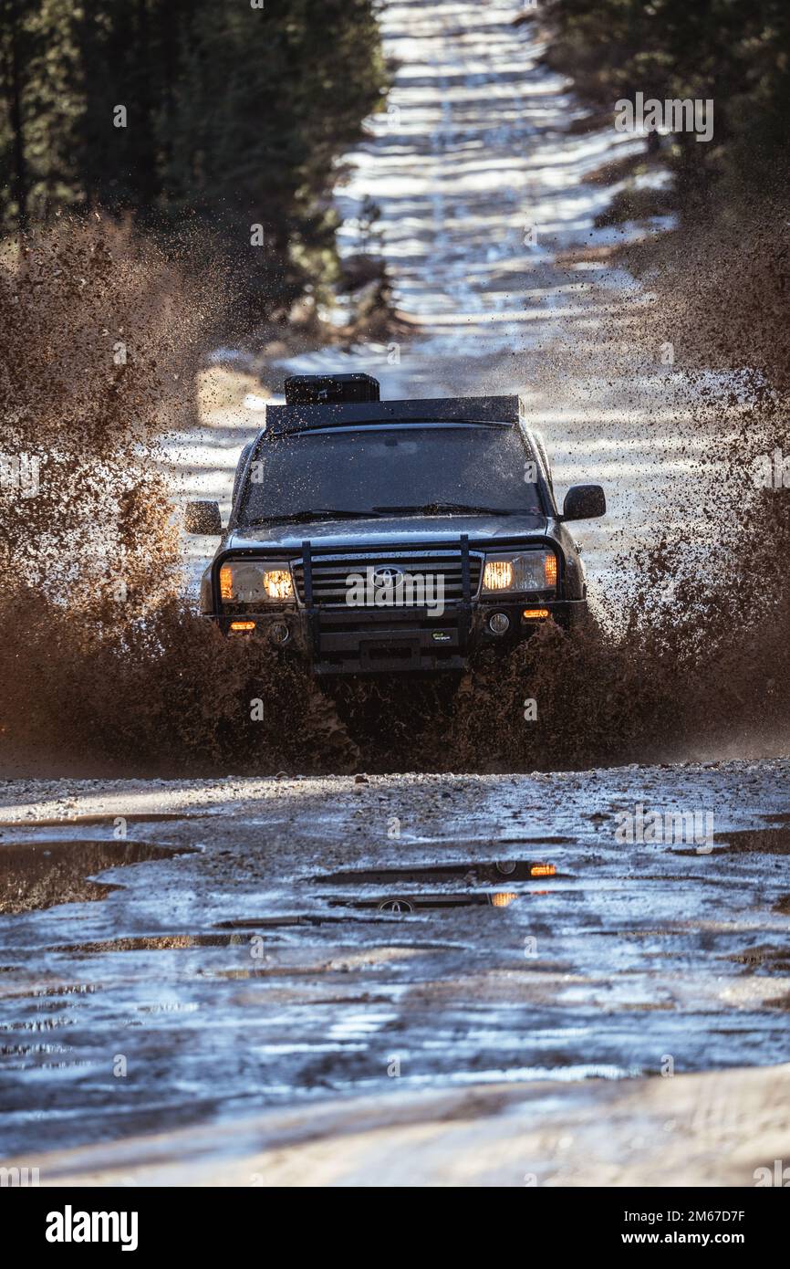 Front Angle view of Off Road Overland Land Cruiser SUV crossing water ...