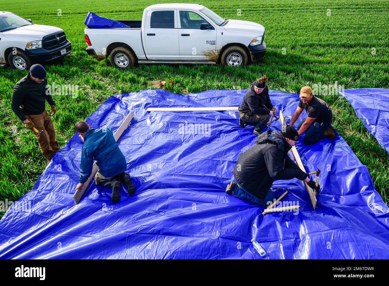 Members of a Defense POW/MIA Accounting Agency (DPAA) recovery team ...